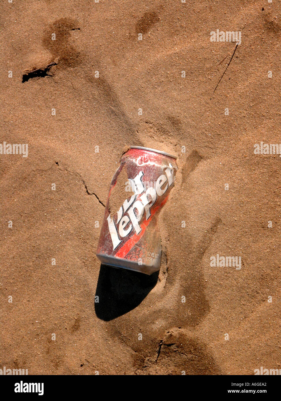 Discarded litter in dry lake bed during drought Stock Photo - Alamy