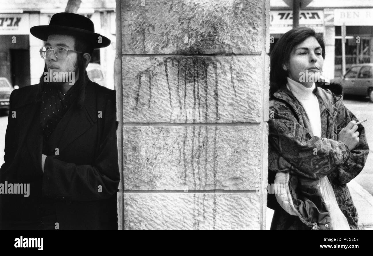 woman orthodoxe Jew leaning on each side of a column in Jerusalem New ...