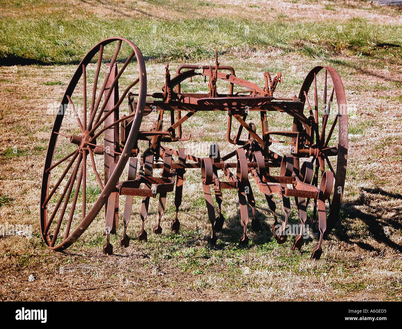 Old Hay rake in field on farm in Midwest of the USA plains which is ...