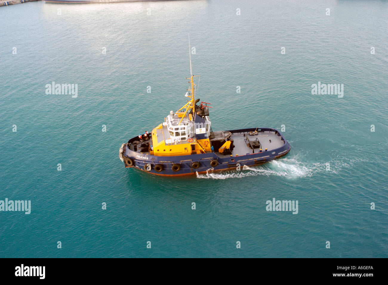 Tug boat to help docking Princess Danae Barbados Stock Photo - Alamy