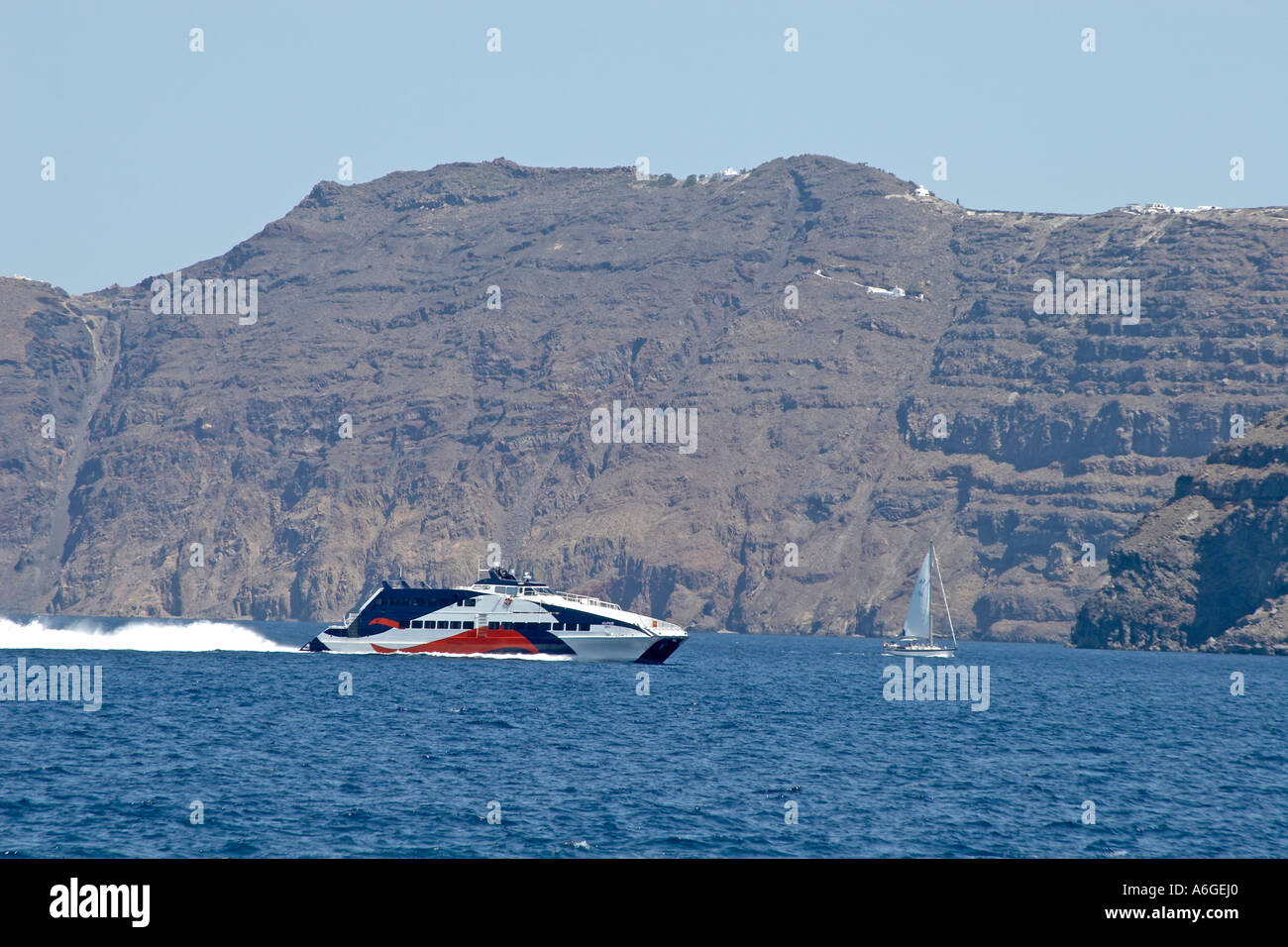 Super Jet fast ferry on Aegean sea by caldera rim Greek Island of ...
