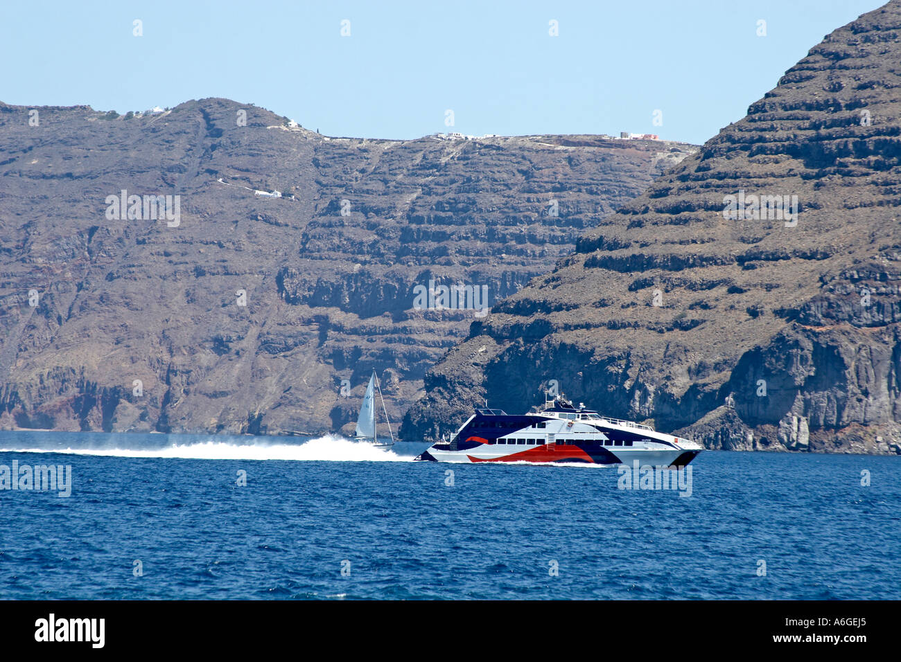Super Jet fast ferry on Aegean sea by caldera rim Greek Island of ...