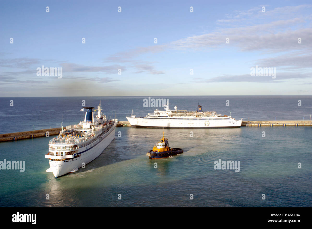 The cruise ship Princess Danae being docked by a tug in Barbados Stock ...
