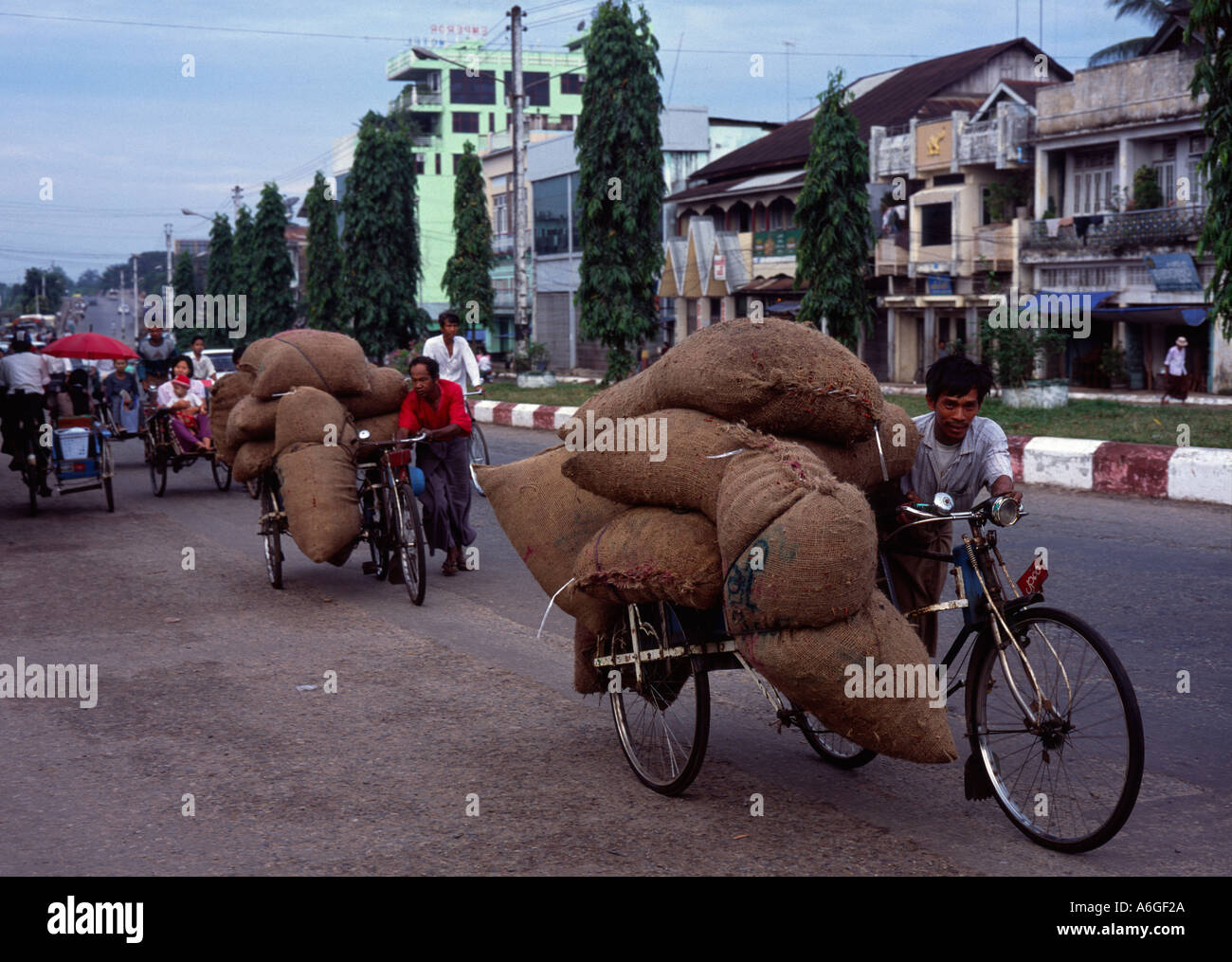 Bago Pegu main road huge bags of chilis being transported on rickshaws ...