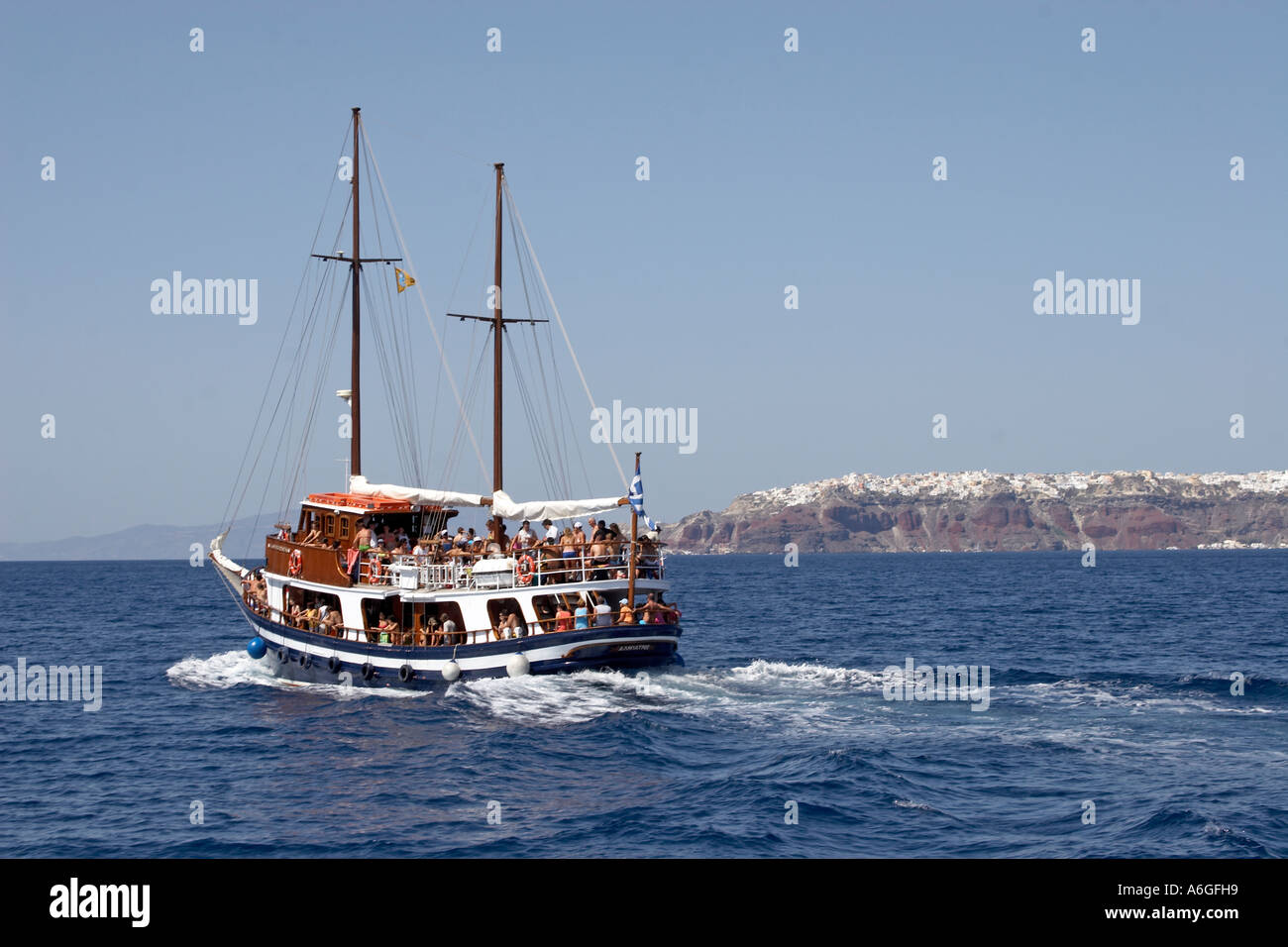 Albatross tourist passenger and fishing boat cruising to Thirassia near ...