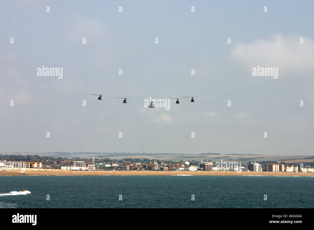 Army Lynx and four Gazelle helicopters in formation over the sea West ...