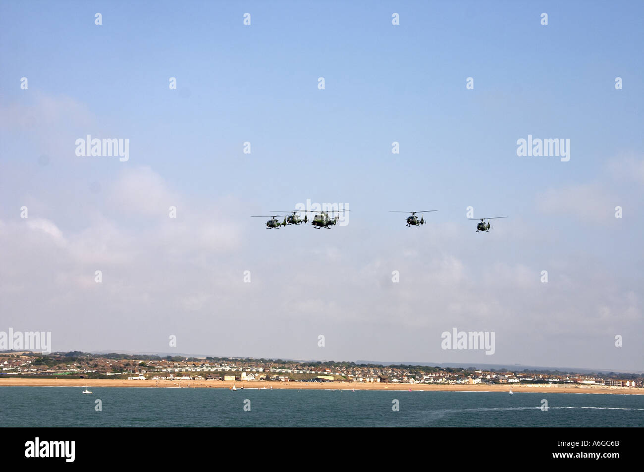 Army Lynx and four Gazelle helicopters in formation over the sea West ...