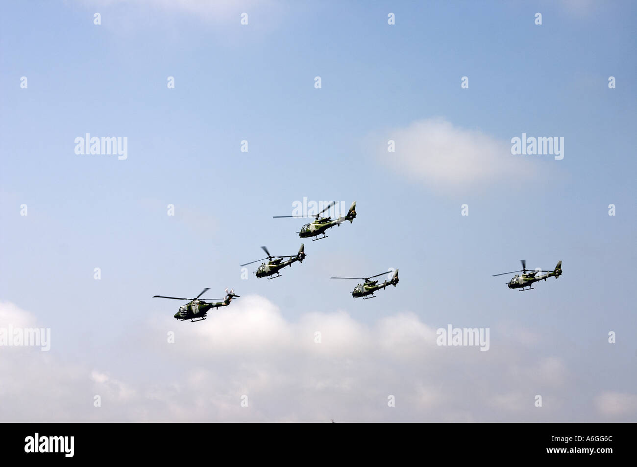Army Lynx and four Gazelle helicopters in formation over the sea West ...