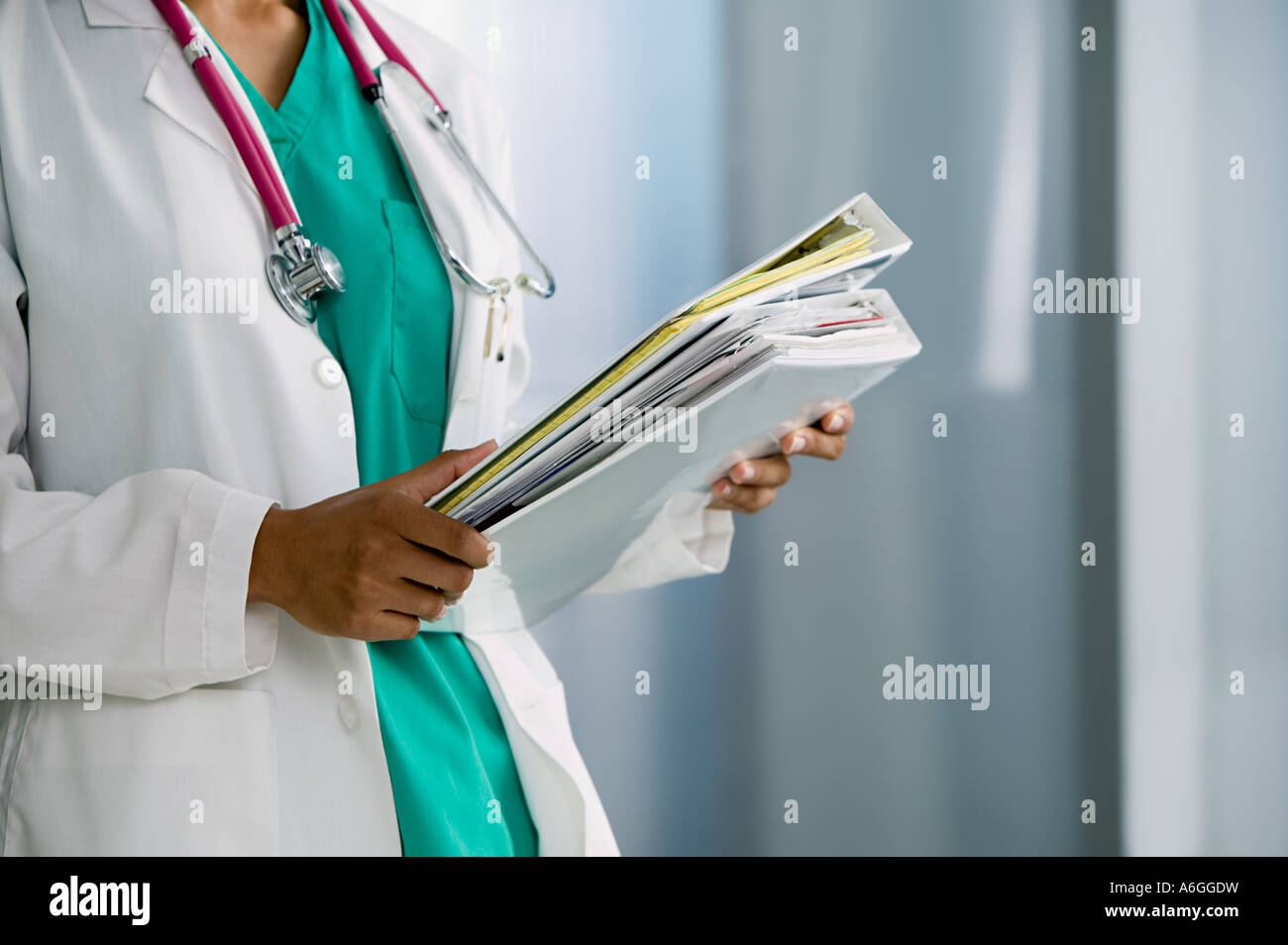 Doctor with folders Stock Photo - Alamy