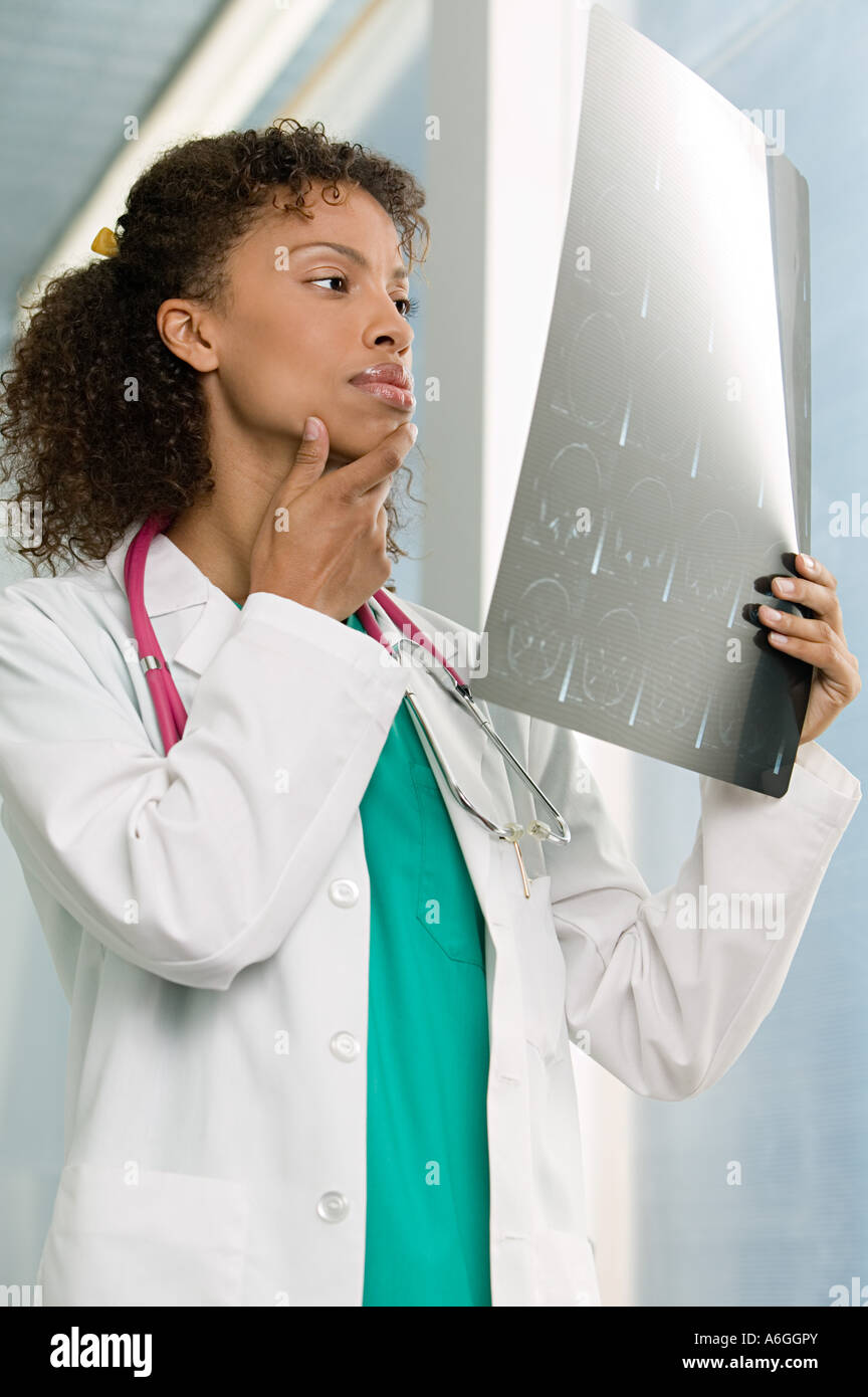 Doctor looking at mri scan Stock Photo - Alamy