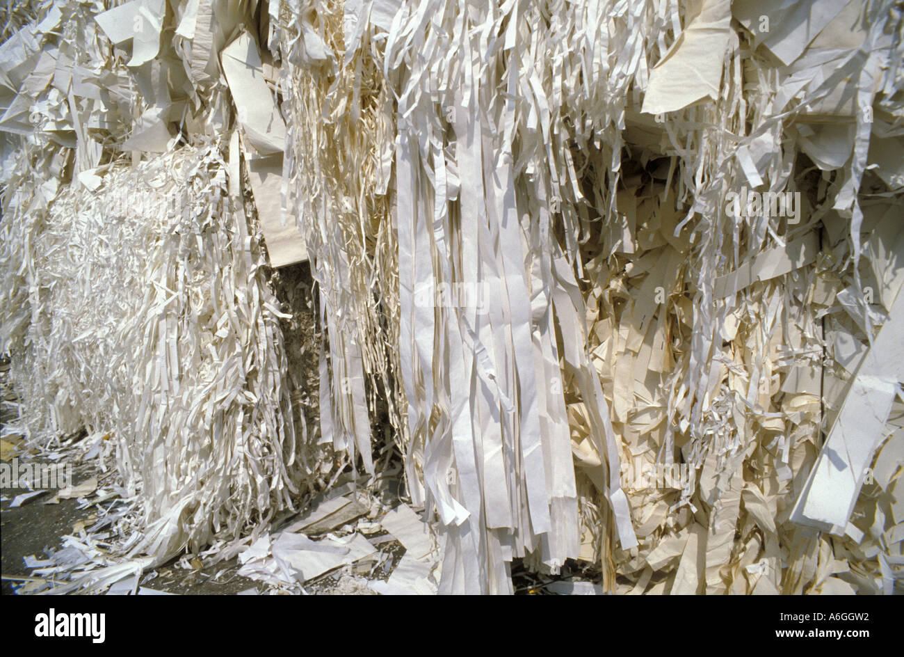 Pile of white and beige waste paper stripes Stock Photo - Alamy
