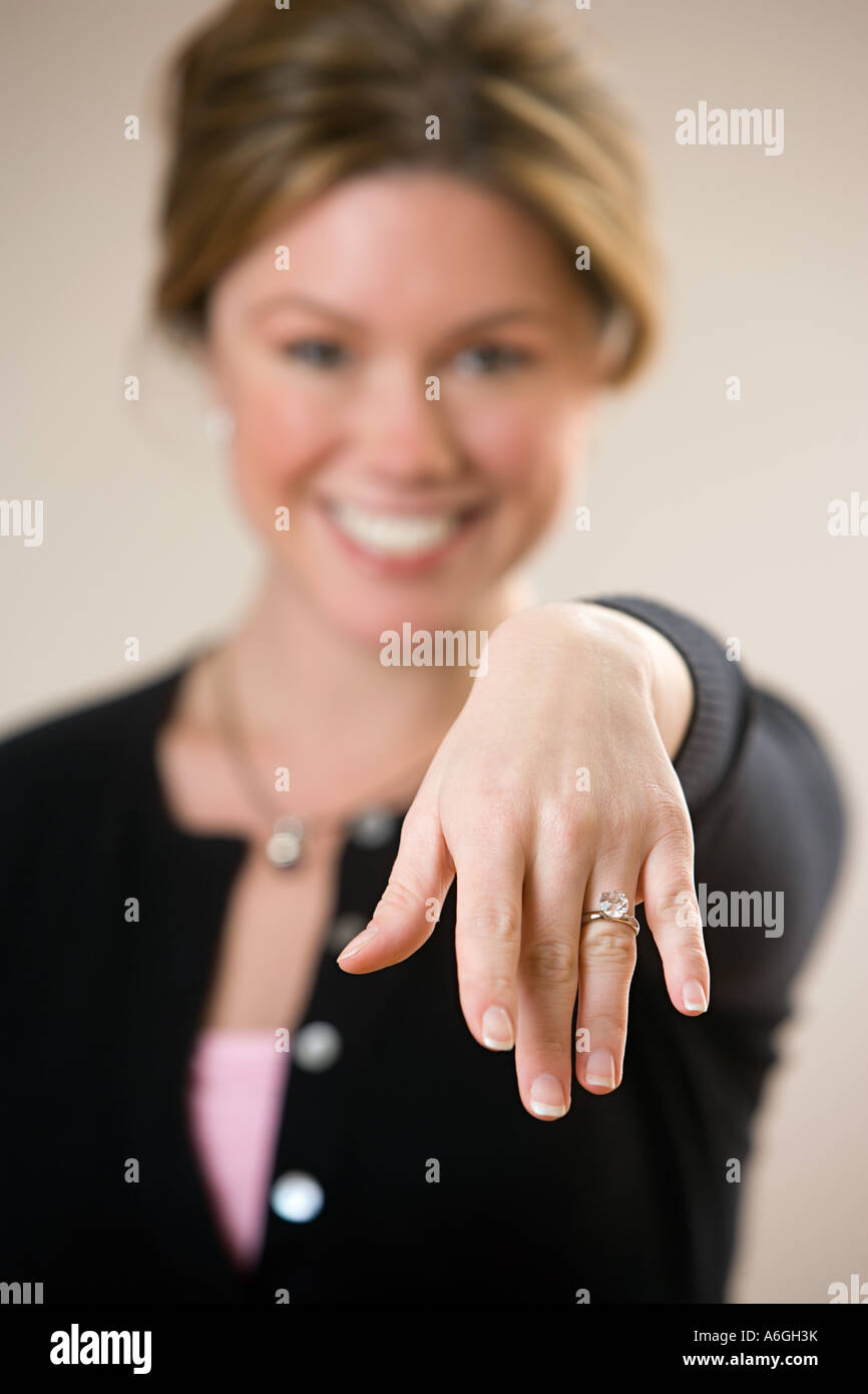 Woman showing engagement ring Stock Photo - Alamy