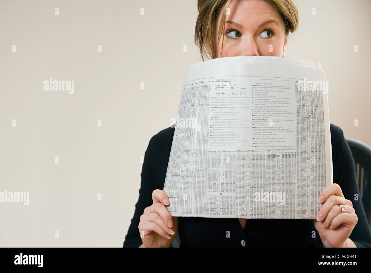 Hiding behind newspaper hi-res stock photography and images - Alamy