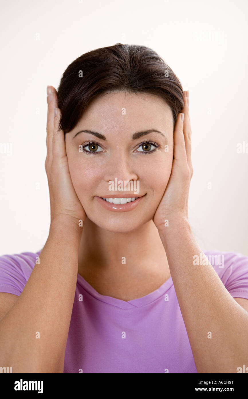 Woman covering ears Stock Photo - Alamy
