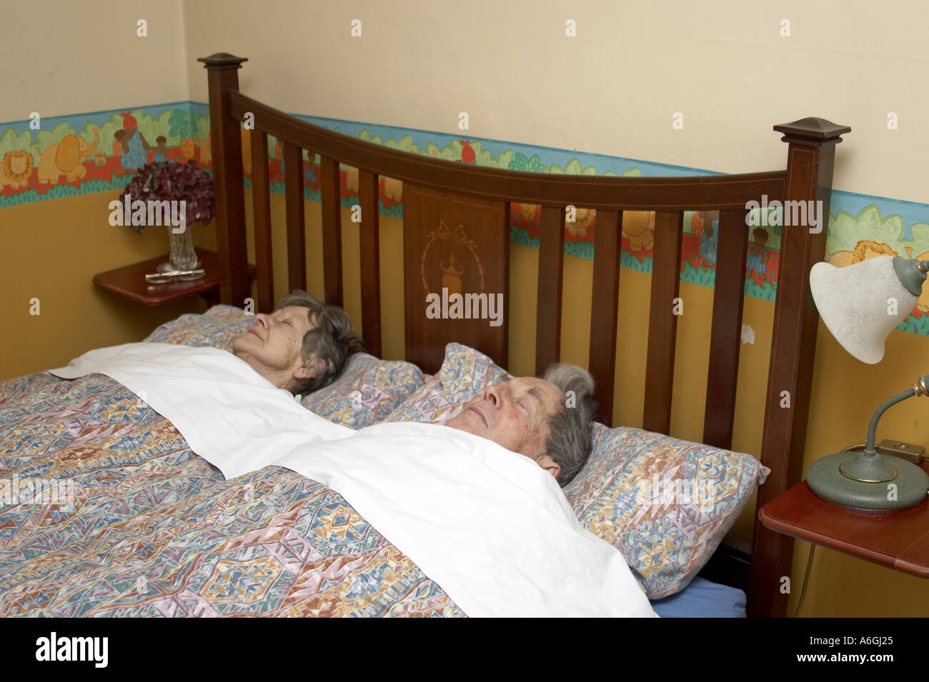 Old or elderly couple of grandparents in bed asleep Stock Photo - Alamy