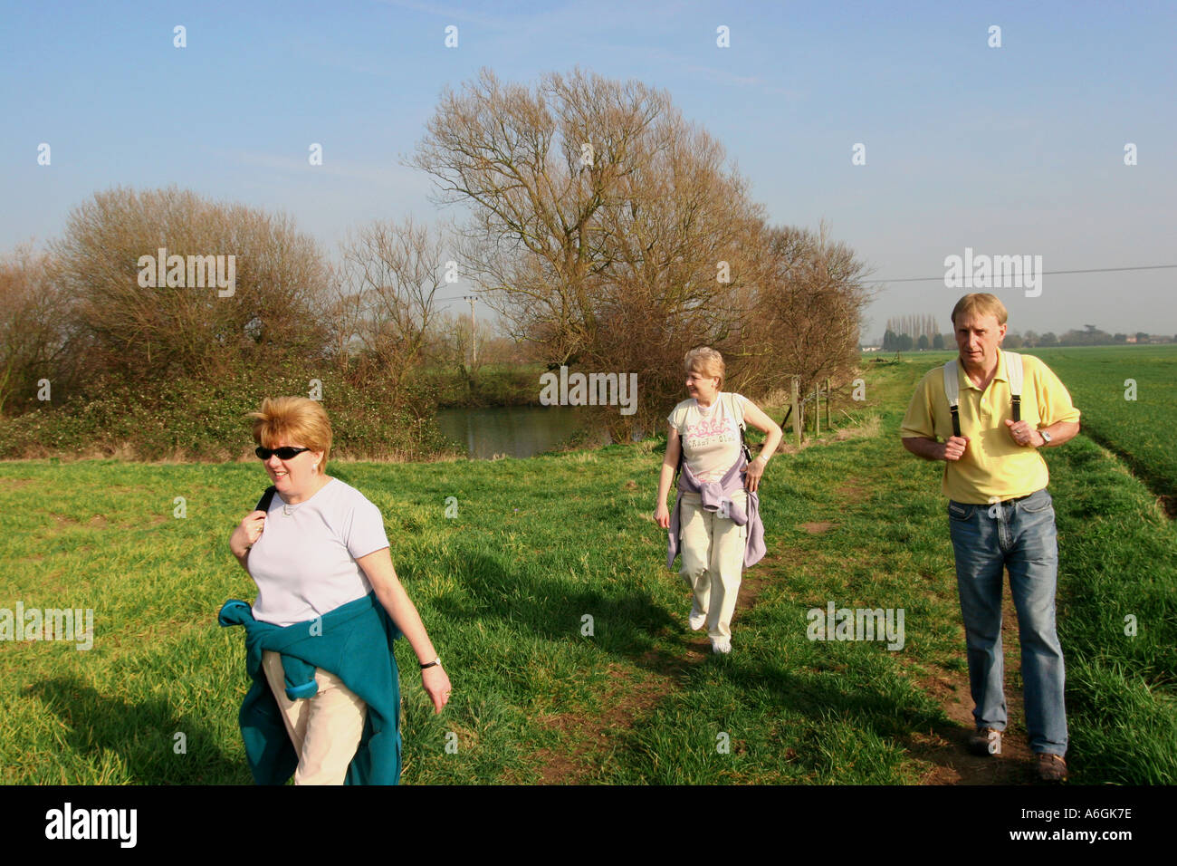 Three Friends Out For A Walk Stock Photo - Alamy