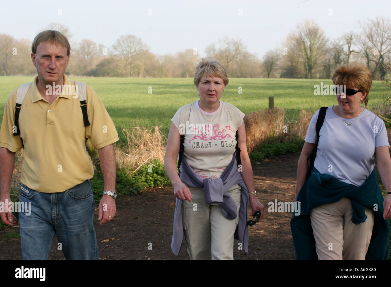 Three Friends Out For A Walk Stock Photo - Alamy