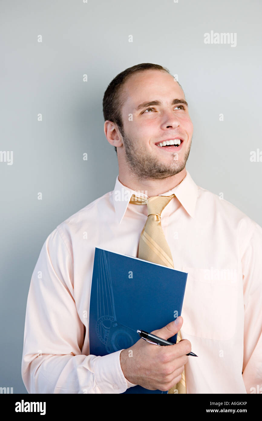 Office worker smiling Stock Photo - Alamy