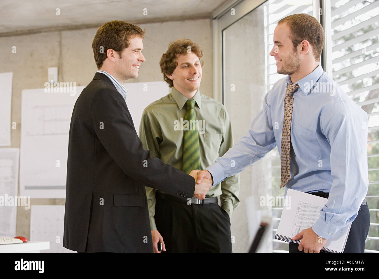 Businessmen shaking hands Stock Photo - Alamy