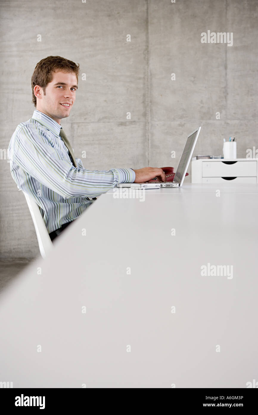 Man at his desk Stock Photo - Alamy
