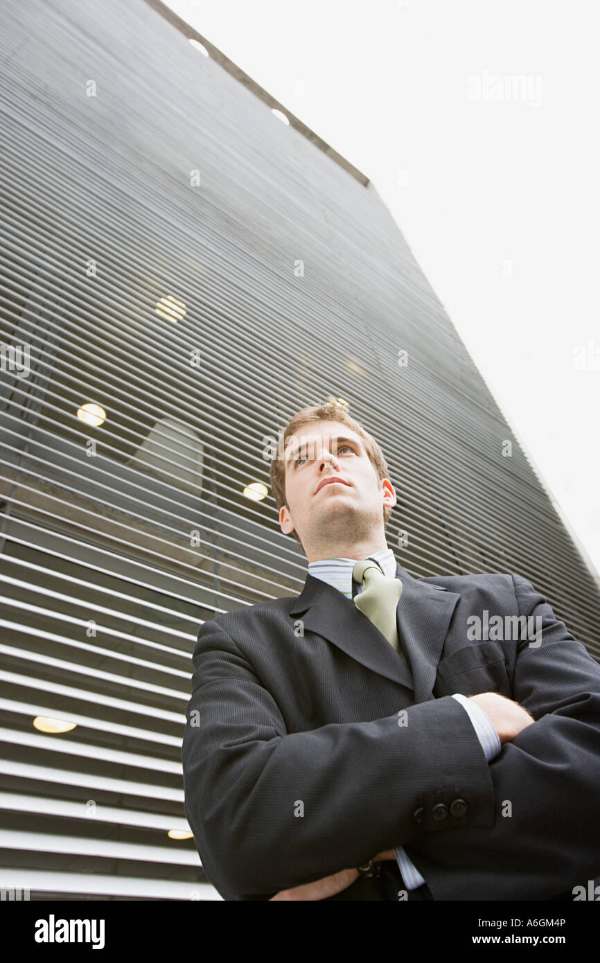 Young businessman looking up Stock Photo - Alamy