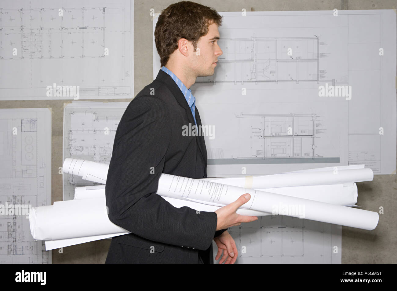 Architect with plans Stock Photo - Alamy