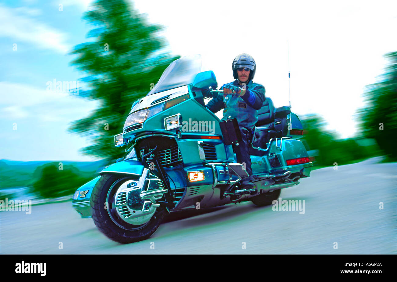 Bike rider touring the mountains in Europe Stock Photo - Alamy
