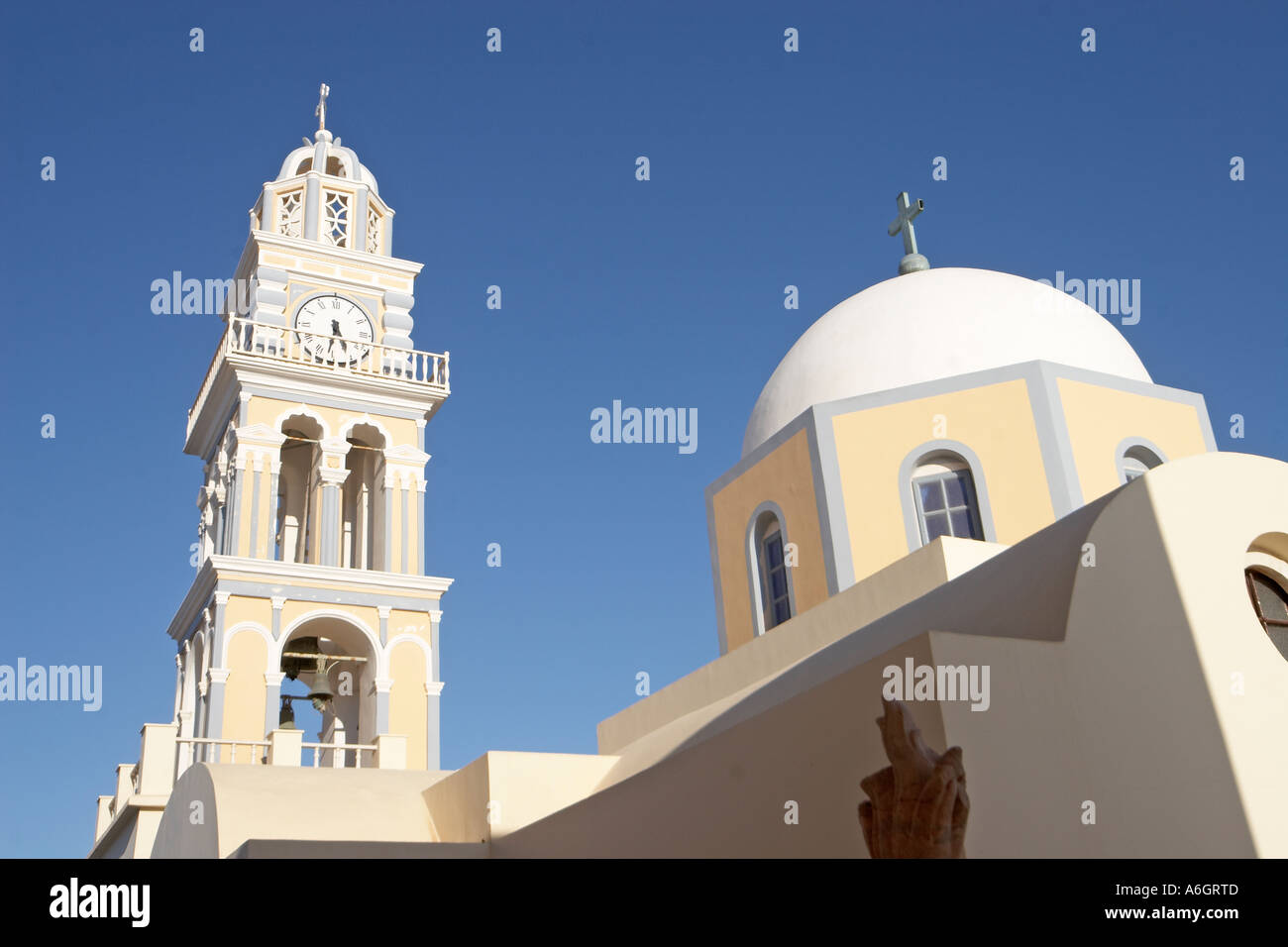 Roman Catholic cathedral with dome and bell tower in town of Fira Greek ...