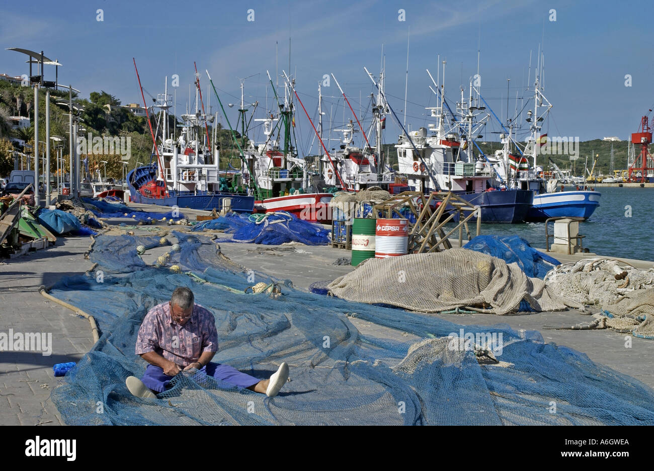 Fishing Nets Under Repair Port Mahon Mediterranean Stock Photo - Alamy