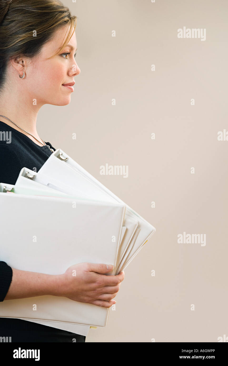 Woman with folders Stock Photo - Alamy