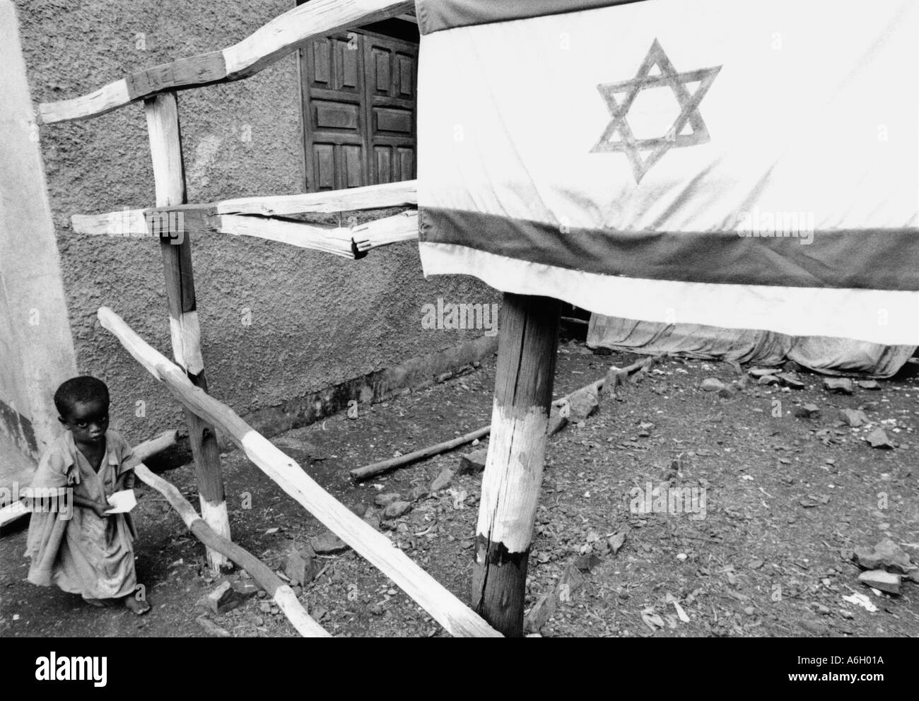 young child holding block note Israeli flag and fence Stock Photo - Alamy