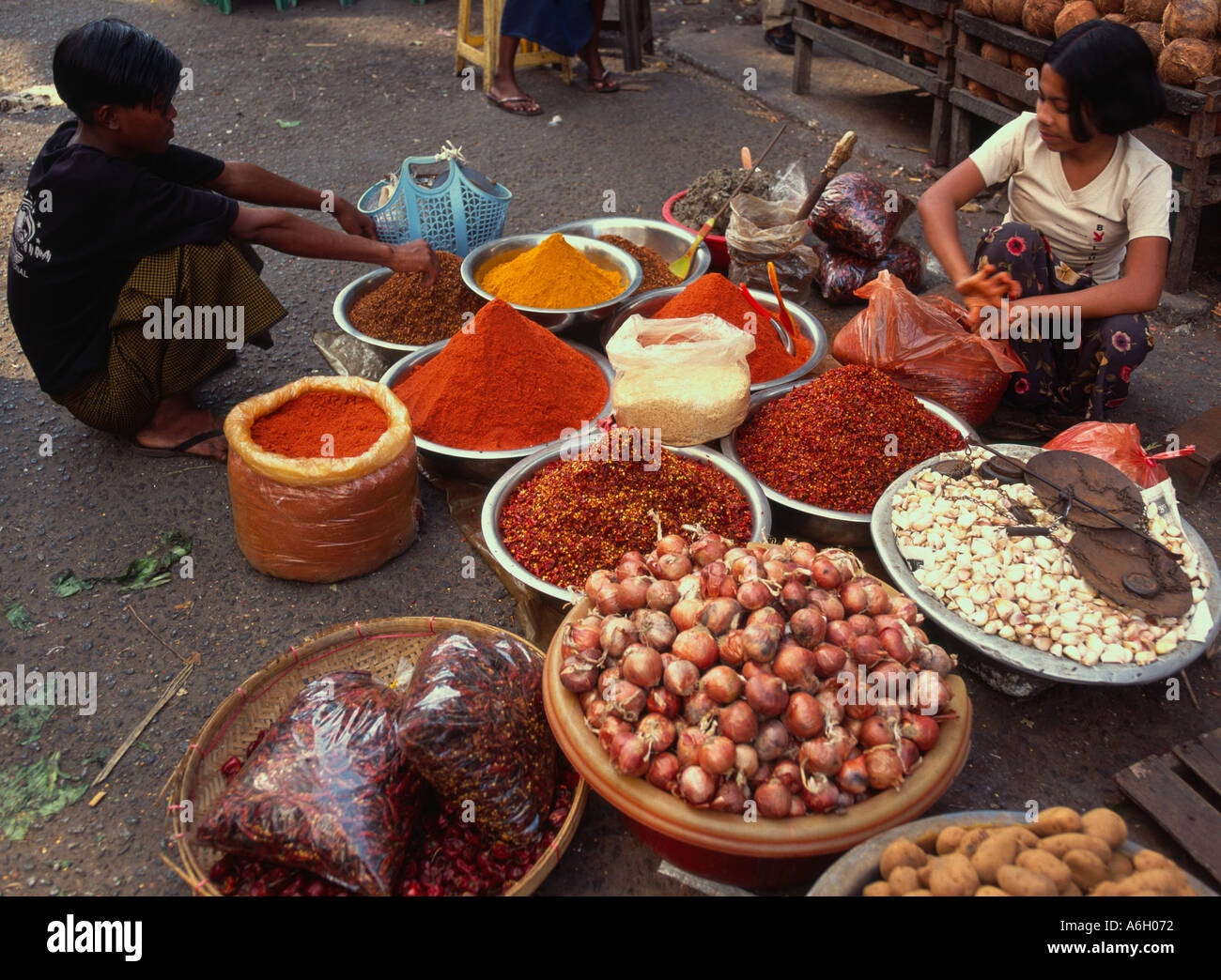 Myanmar Yangoon Rangoon street market spice stall on the ground with ...
