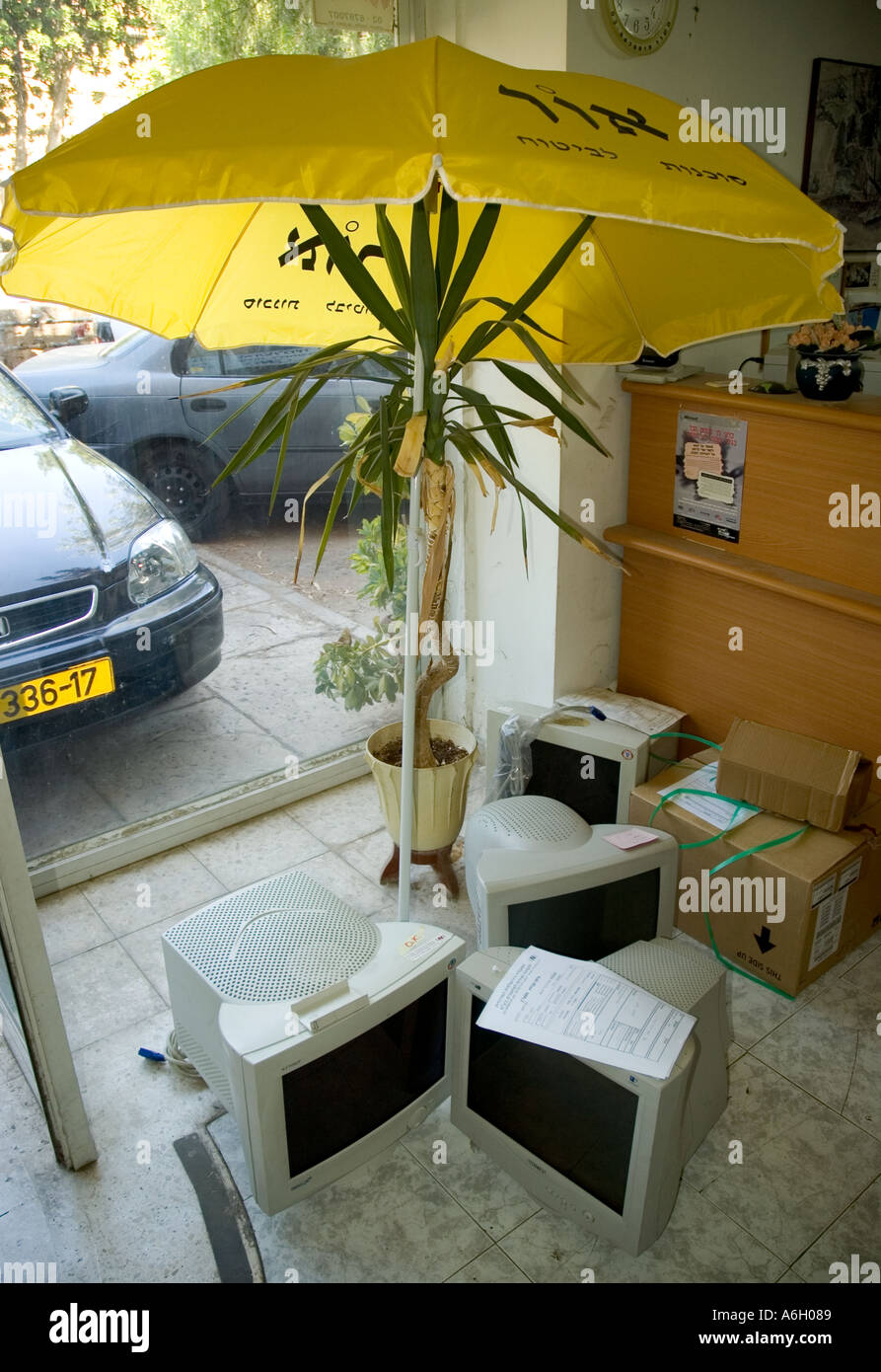 Computer shop computer screen on the floor sheltered by a yellow ...