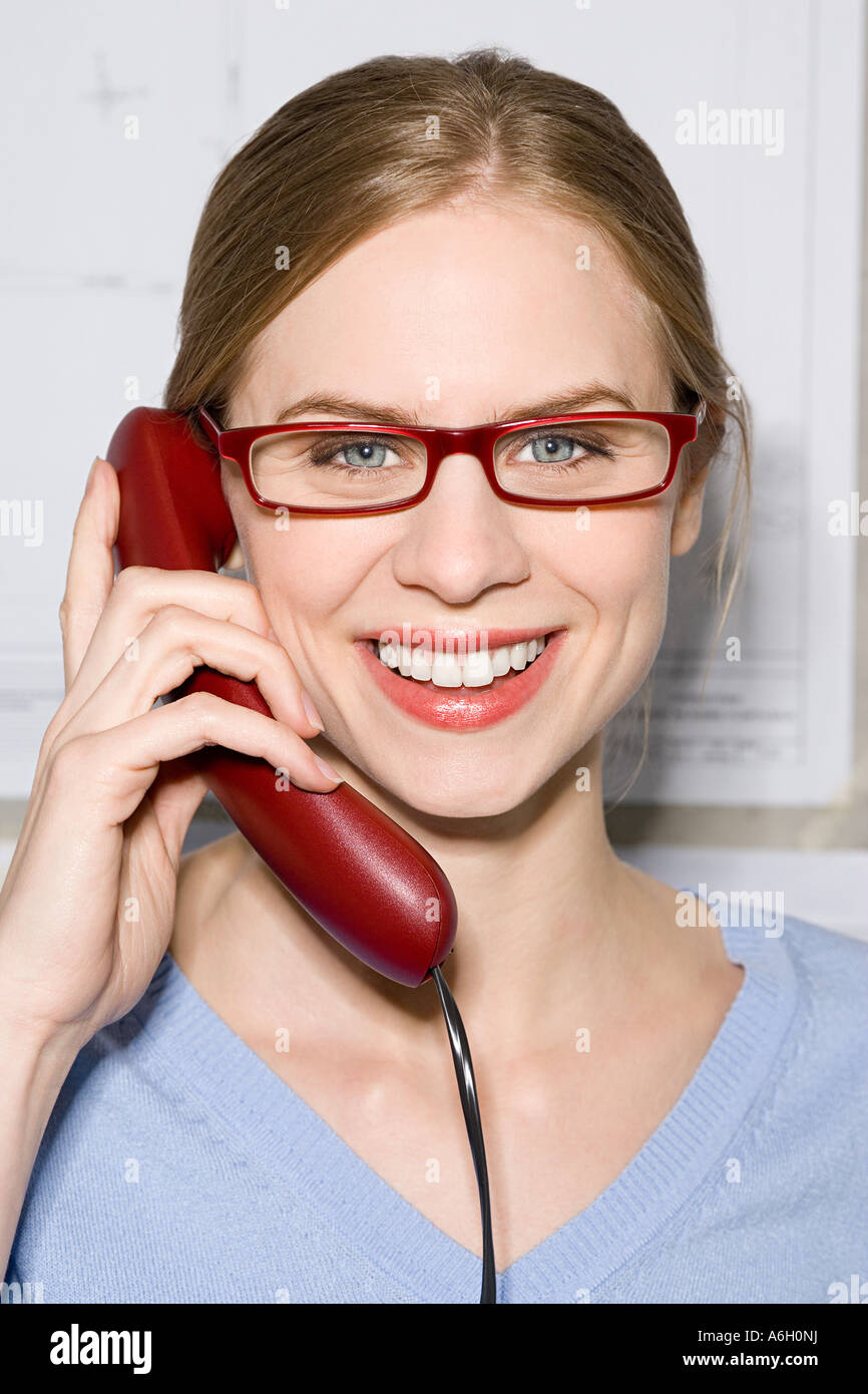 Young woman on telephone Stock Photo - Alamy