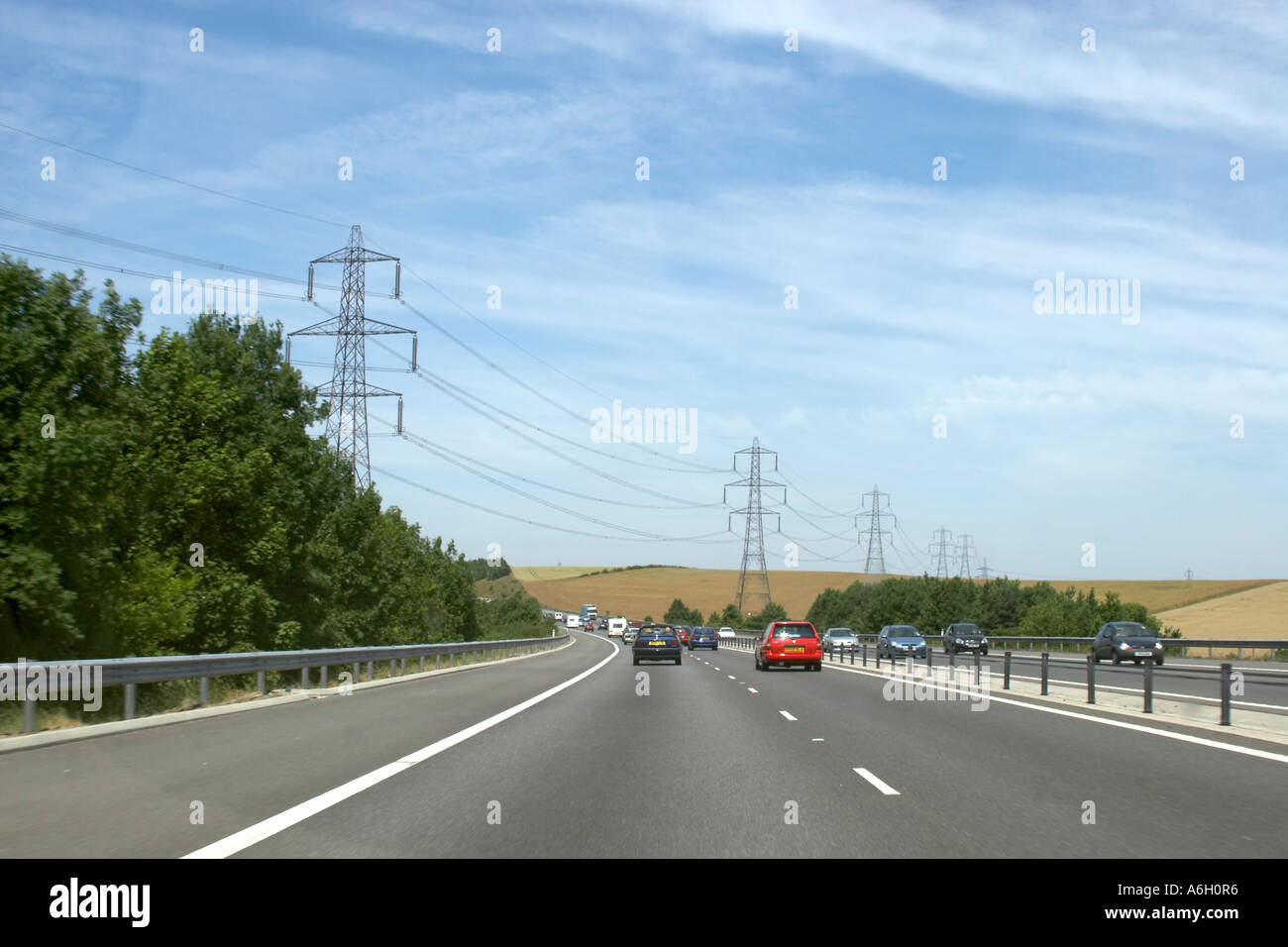 M11 Motorway with pylons and electricity transmission cables crossing ...