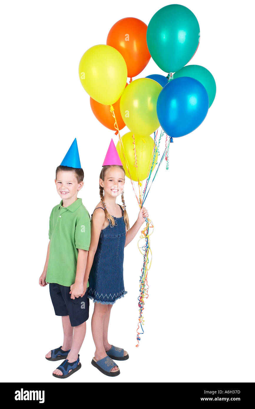 Two children holding balloons uid 1434088 Stock Photo - Alamy