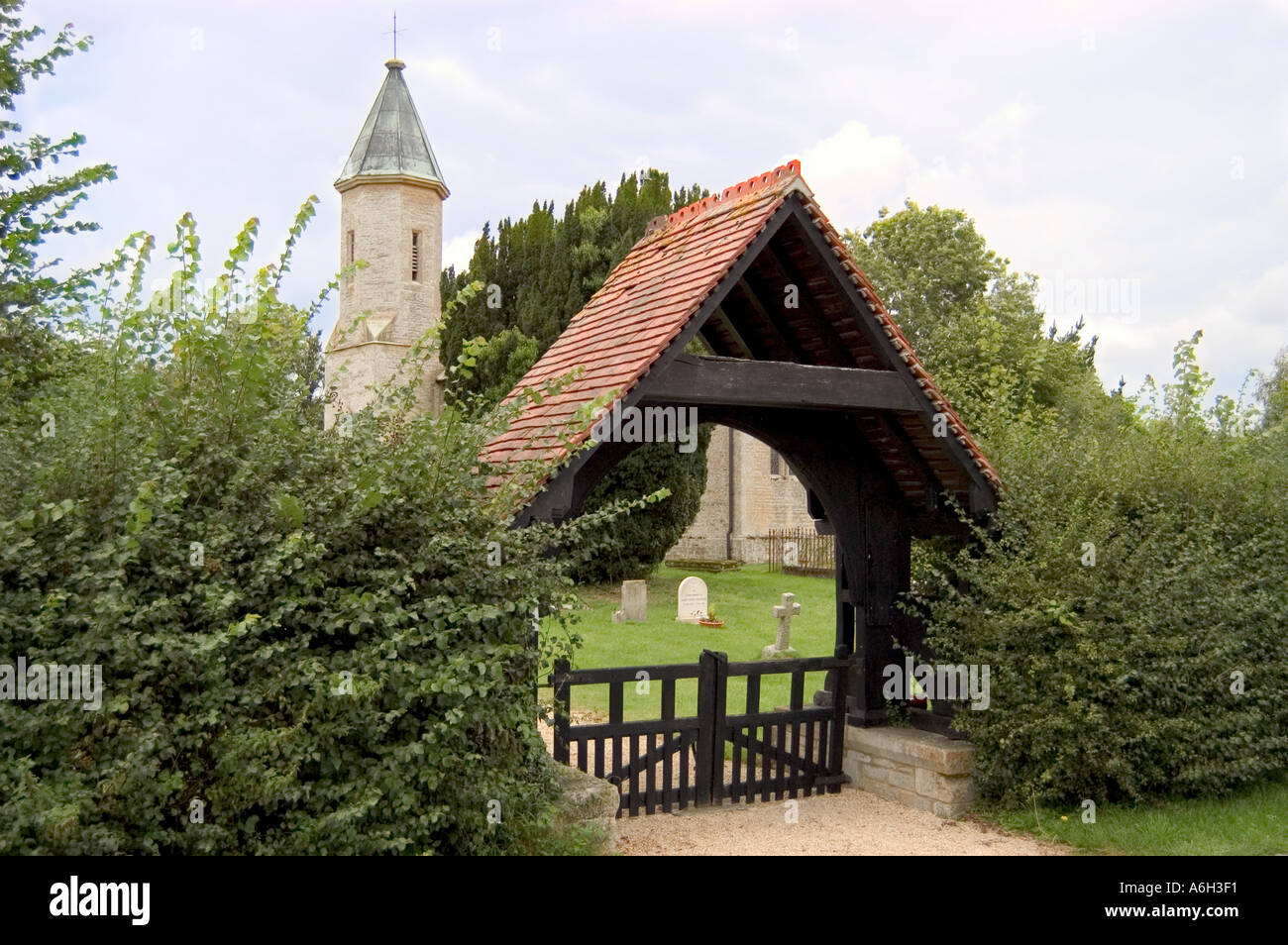 English country church viewed through the gatehouse Stock Photo - Alamy