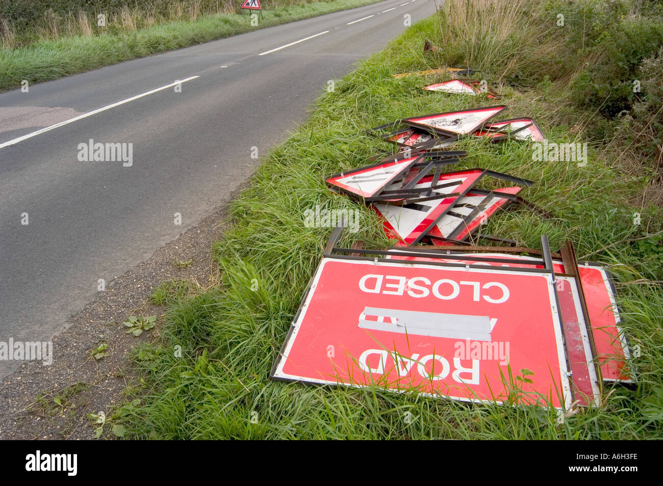 Road work and direction signs on the side of the road Stock Photo - Alamy