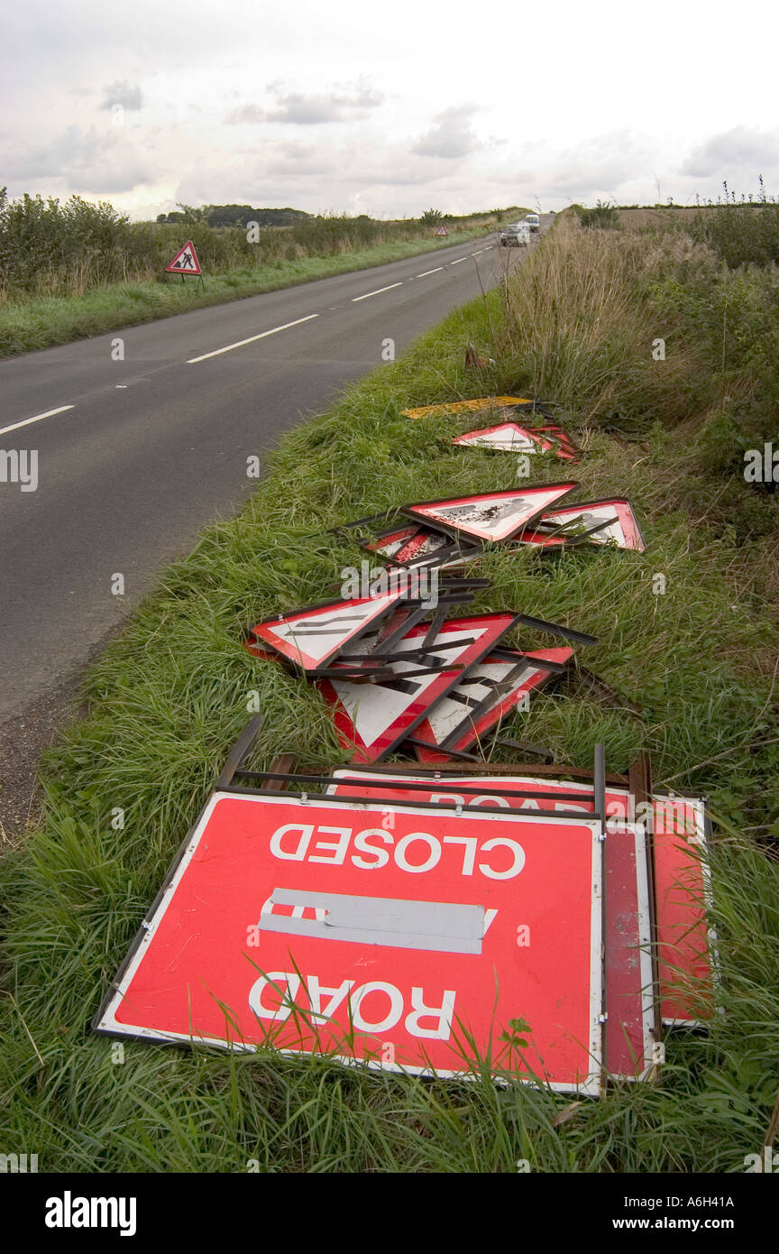 Road work and direction signs on the side of the road Stock Photo - Alamy