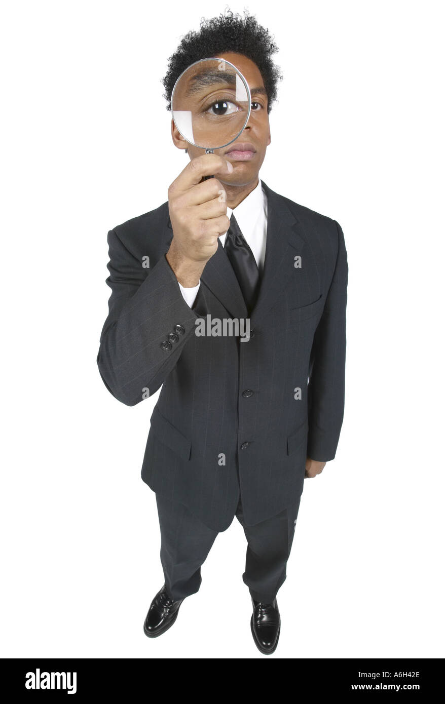 Business man with a magnifier Stock Photo - Alamy