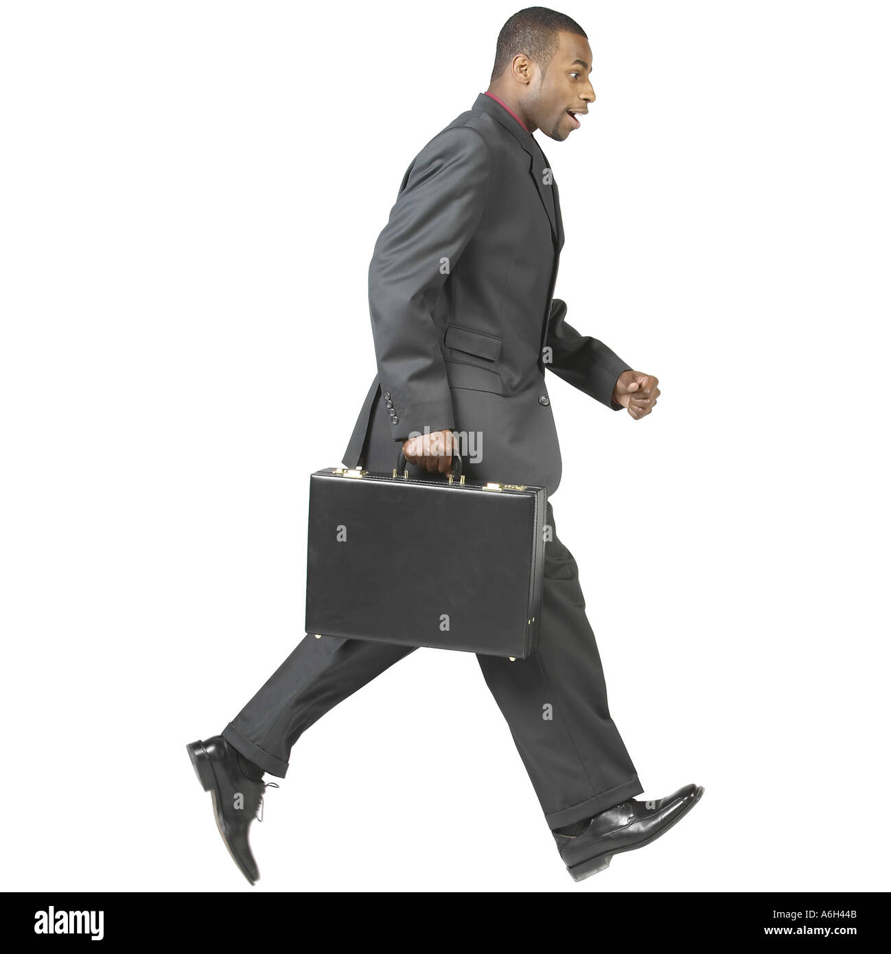 businessman carrying briefcase and running Stock Photo - Alamy