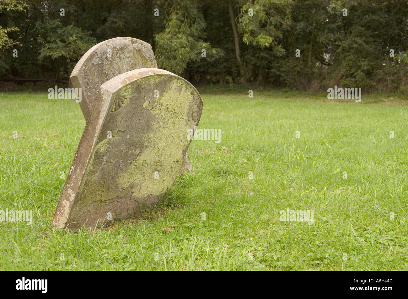 two grave stones in a levelled graveyard Stock Photo - Alamy
