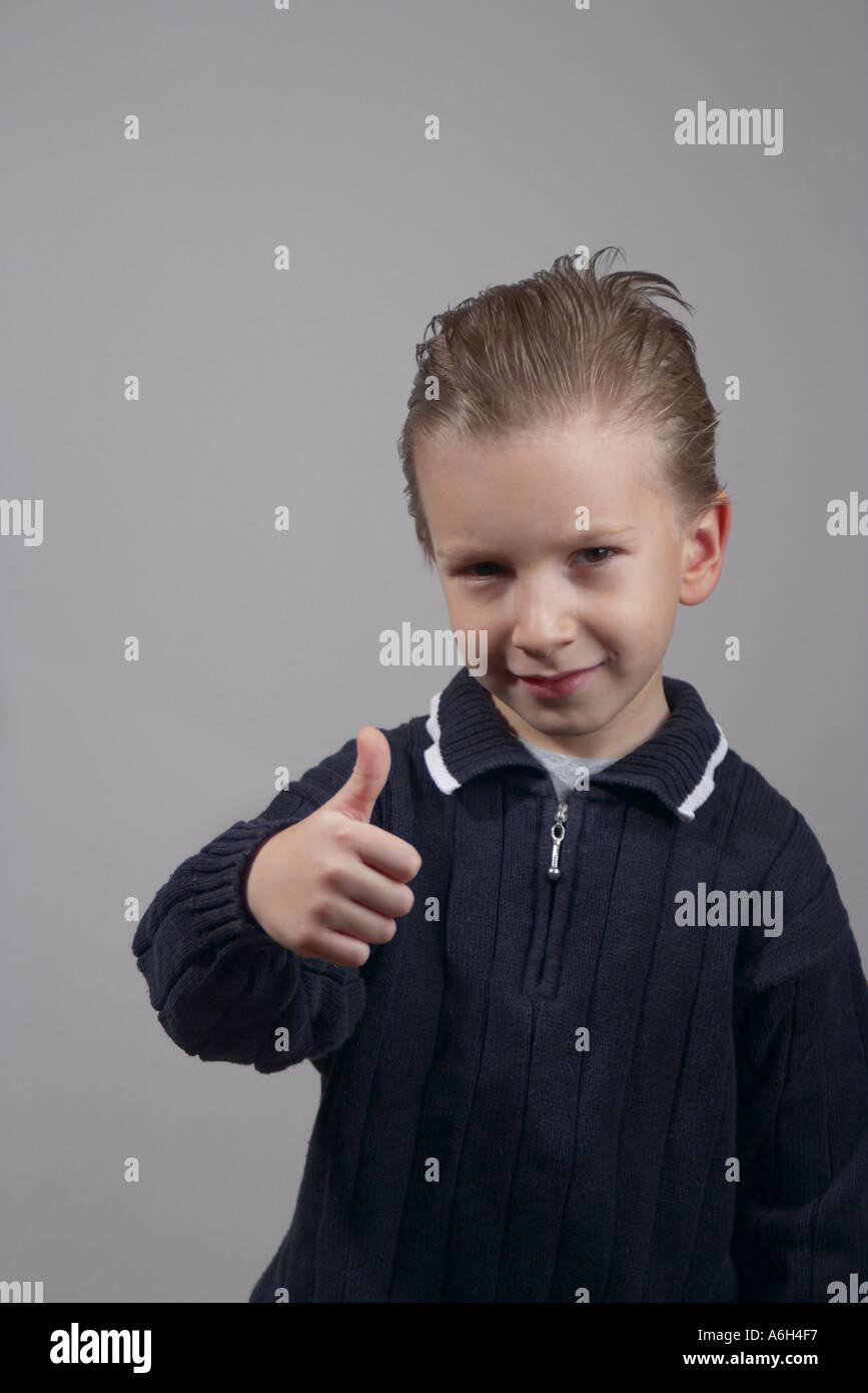 Friendly kid poses in studio Stock Photo - Alamy