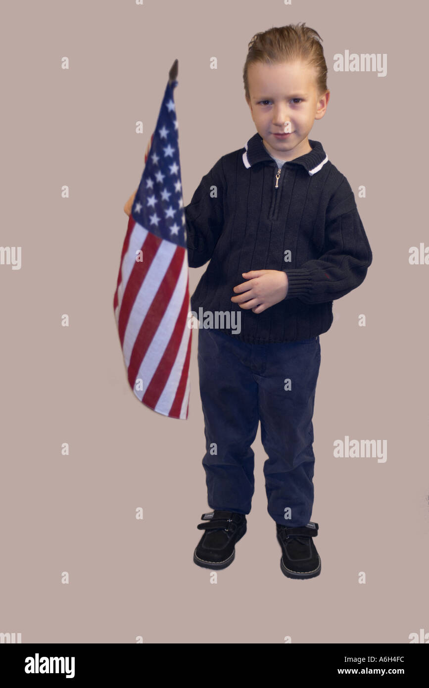 Friendly kid poses in studio american flag in his hand Stock Photo - Alamy