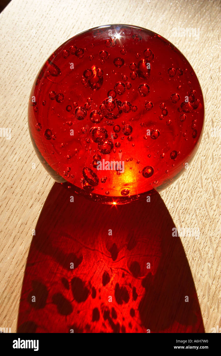 Abstract image of sunlight shining through red glass decorative art ...