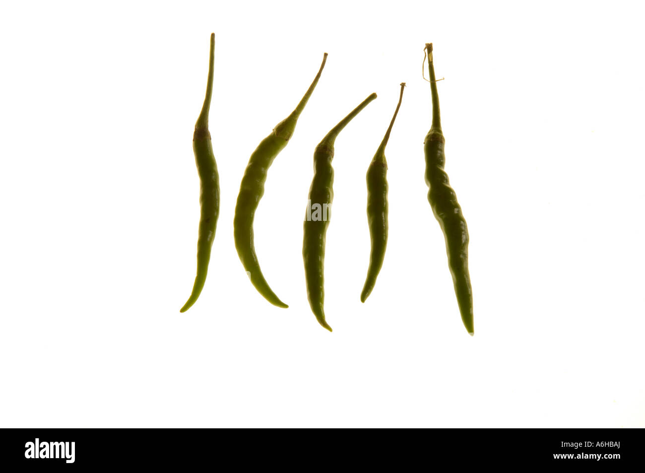 Five green chillies Stock Photo - Alamy