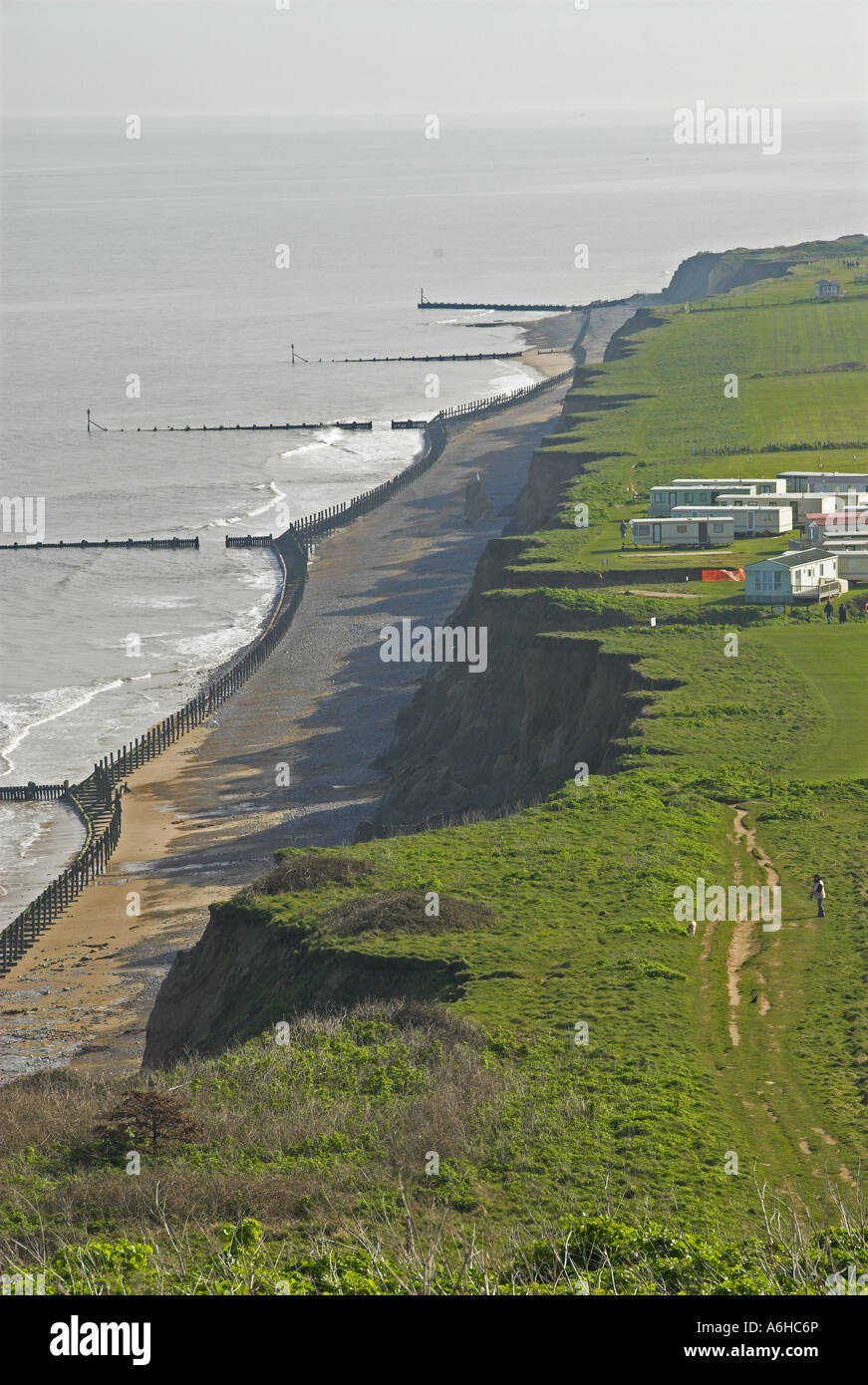 North Norfolk Coastal cliffs showing coastal path and sea defences ...