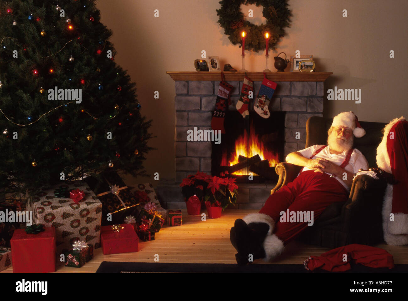 Santa Asleep by the Fireplace Stock Photo - Alamy