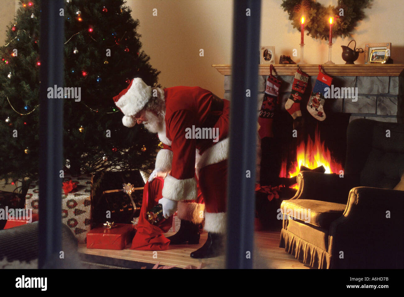 Santa Leaving Presents Stock Photo - Alamy