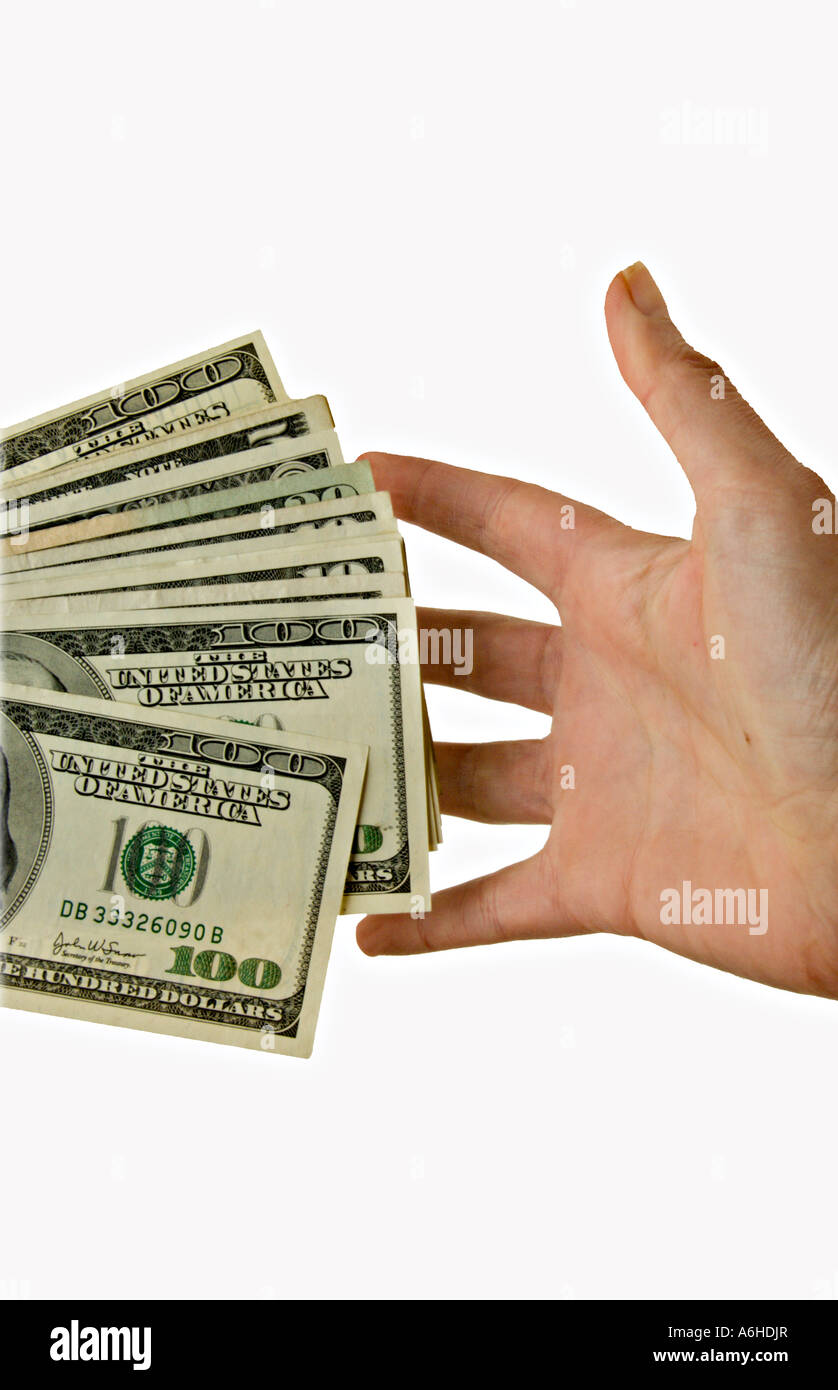 Hand grabbing US dollar bill banknotes Stock Photo - Alamy